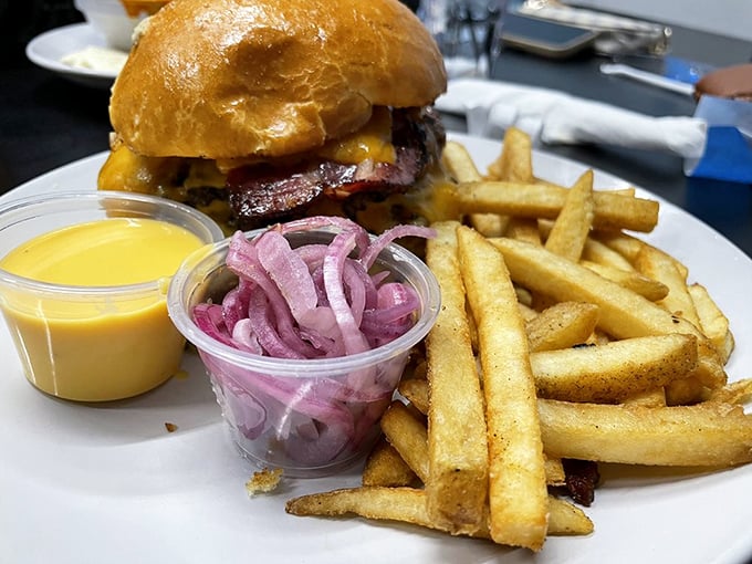 This burger isn't just lunch&mdash;it's therapy on a plate, complete with golden fries and pickled red onions for that perfect tangy contrast.