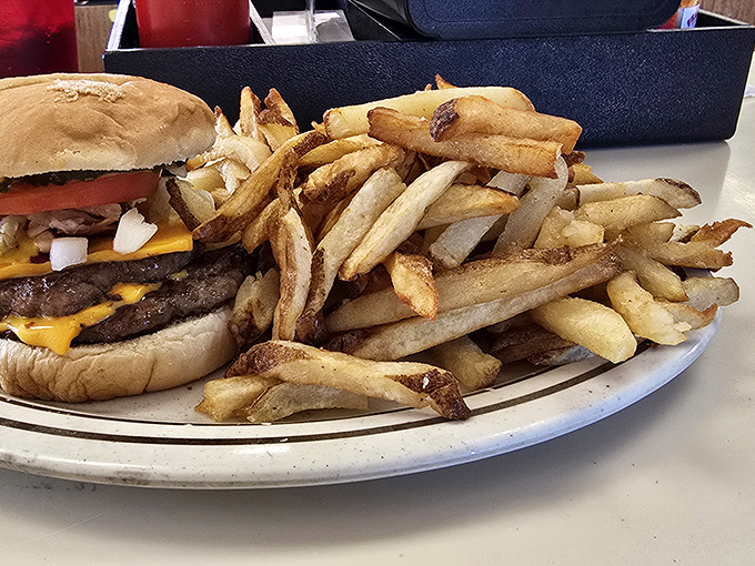 Classic American comfort: a proper burger with fries that understand the assignment and execute it flawlessly.