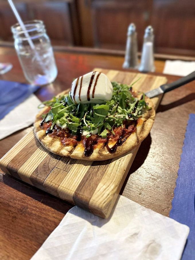 This flatbread isn't just a meal, it's a flavor playground where arugula, burrata and balsamic come together for a sophisticated romp.