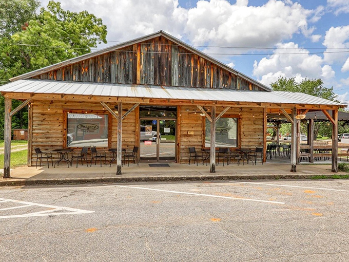 The Buzzery brings rustic charm to new heights with weathered wood that tells as many stories as the folks gathering on its inviting porch.
