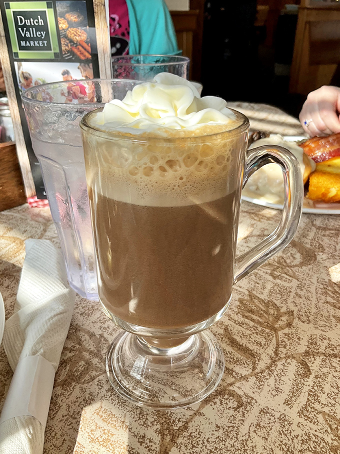Hot coffee elevated to an art form – where whipped cream doesn't merely top your beverage but crowns it with a pillowy flourish worth savoring.