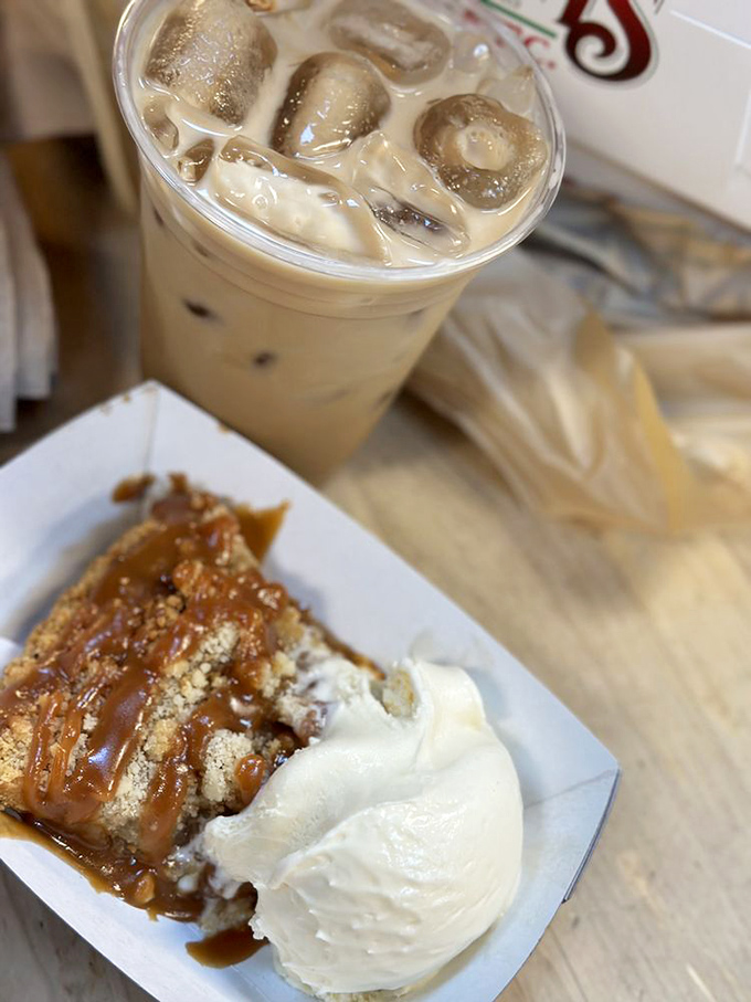 Caramel cascading over apple crumb pie alongside an iced latte &ndash; a pairing that makes coffee and donuts look like amateurs.