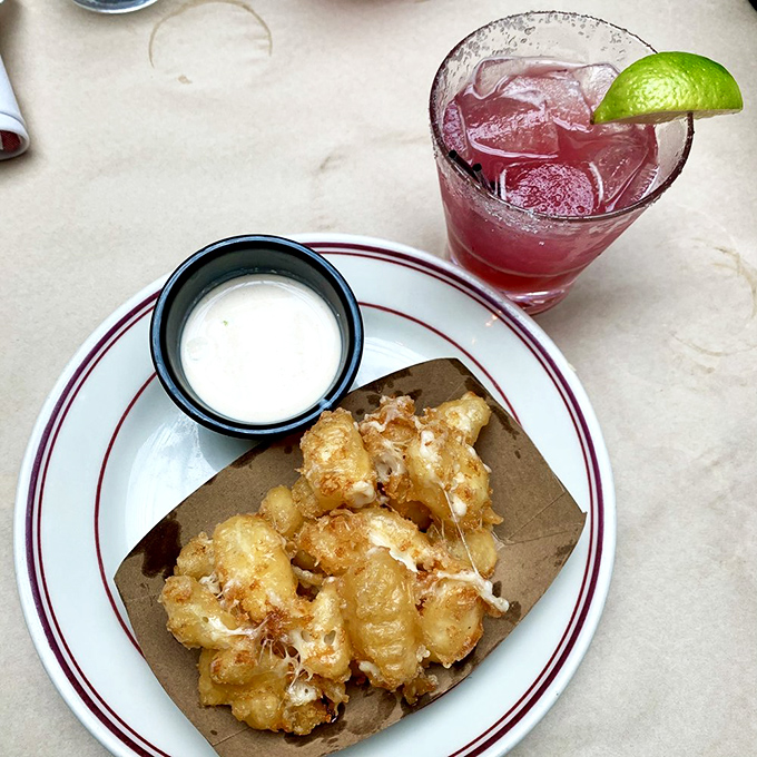 Fried cheese curds with dipping sauce&mdash;proof that sometimes the simplest pleasures are the most divine. Listen closely and you might hear them squeak.