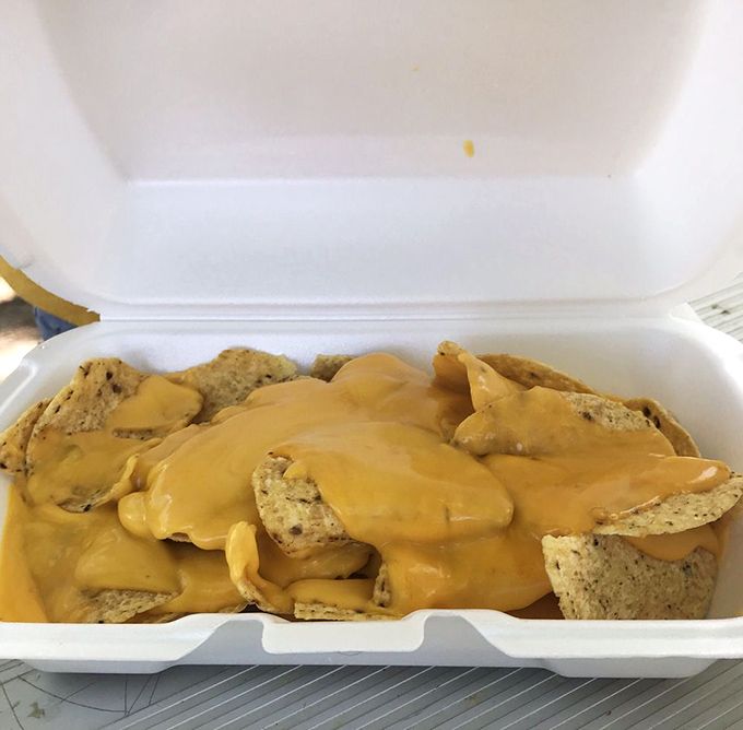 Nachos swimming in cheese sauce&mdash;proof that sometimes the simplest pleasures are the most satisfying. No fancy plating required. 