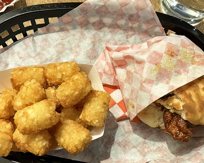 The breakfast of champions redefined: crispy chicken on a buttery biscuit with golden tots that'll make you forget pancakes ever existed.