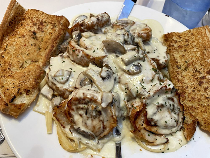 Pasta swimming in creamy mushroom sauce with perfectly cooked chicken—comfort food that hugs you from the inside out.