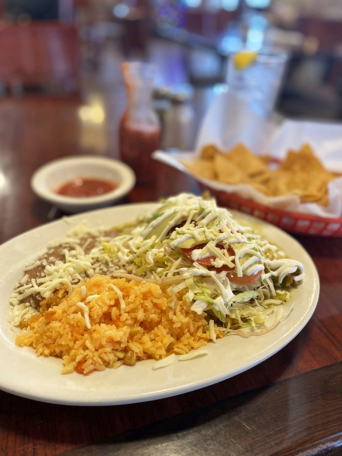 These chicken enchiladas aren't just covered in cheese&mdash;they're blanketed in it. The vibrant rice provides the perfect complement to this comfort food classic.
