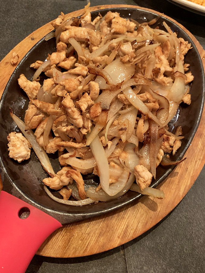 Sizzling chicken fajitas that announce their arrival with both sound and aroma&mdash;like a rock star making an entrance that demands your full attention.