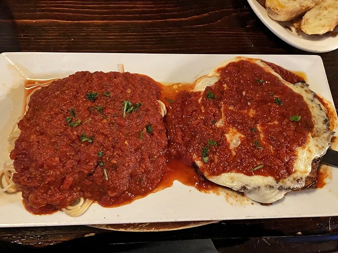 Spaghetti and chicken parm—the Frank Sinatra of Italian-American dishes. That sauce looks like it's been simmering since breakfast, exactly as it should be.