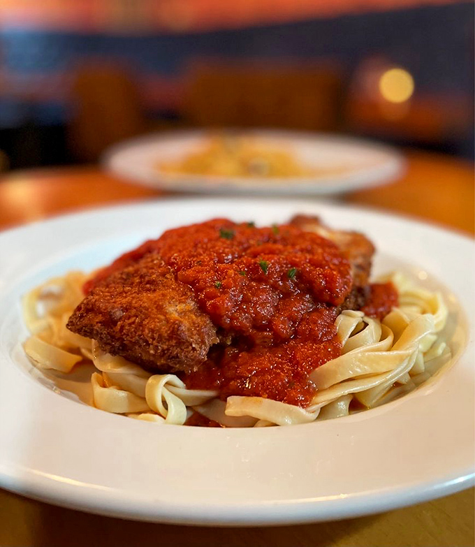 Chicken Parmesan that would make an Italian grandmother nod in approval. Crispy, saucy, cheesy perfection atop a bed of pasta.