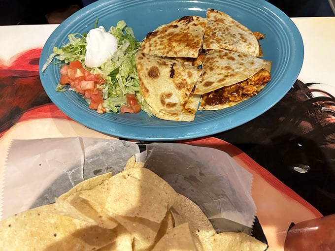 Quesadillas that achieve the golden ratio of crisp exterior to molten interior. Served with the holy trinity of toppings: sour cream, guacamole, and pico de gallo.