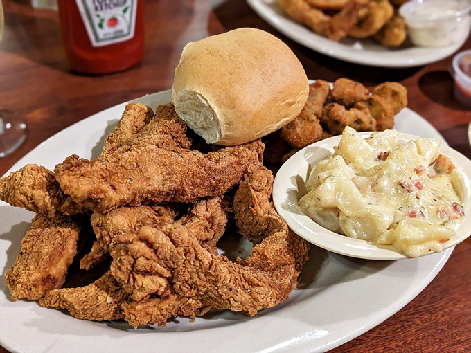 Fried chicken that makes you question every other version you've ever had&mdash;golden, crispy, and served with potato salad that grandma would approve of.