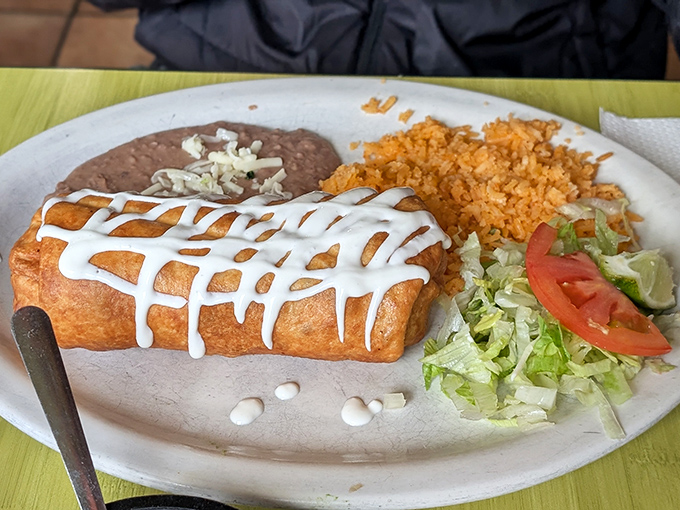 Golden-fried perfection drizzled with sour cream &ndash; this chimichanga has the satisfying crunch that makes you close your eyes with each bite.