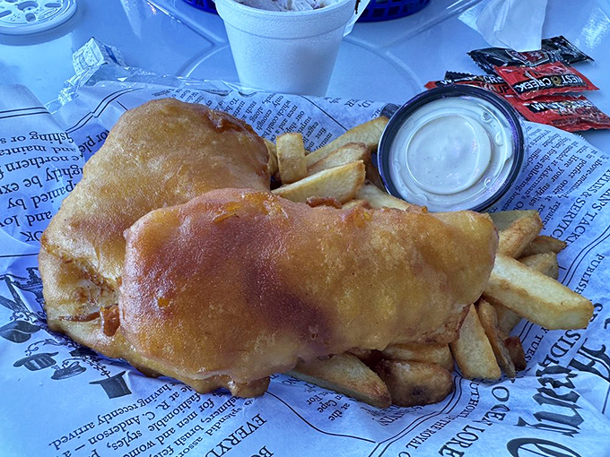 The newspaper wrapping isn't just nostalgic &ndash; it's practical. Though at The Chipper, this fish is so good you'll want to frame it, not read it.