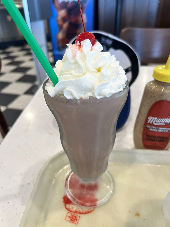 A chocolate milkshake topped with whipped cream and a cherry &ndash; the sweet finale that makes you realize dessert was never optional.