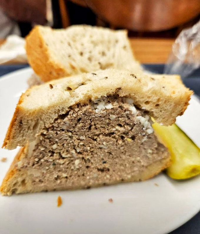 This chopped liver sandwich with its pickle spear sidekick represents old-world delicatessen artistry that's increasingly rare in our fast-casual dining landscape.