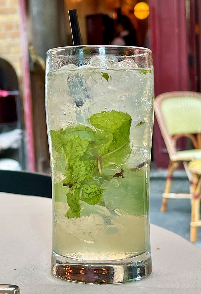 A proper mojito with fresh mint leaves standing at attention&mdash;the kind of drink that makes you forget you're in Philadelphia, not Paris.