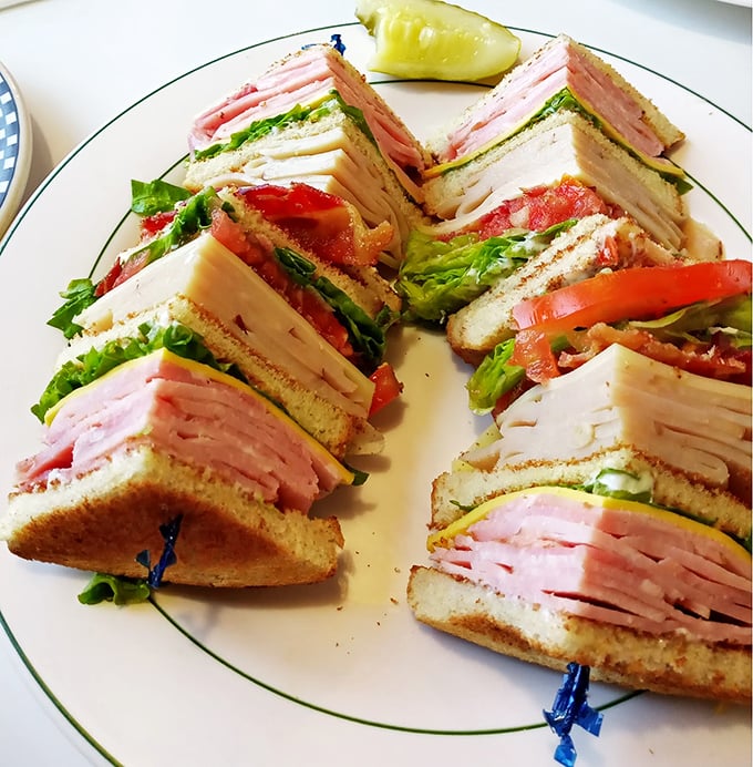 The club sandwich—architecture you can eat. Those perfectly stacked layers deserve their own blueprint, with each ingredient playing its essential role.