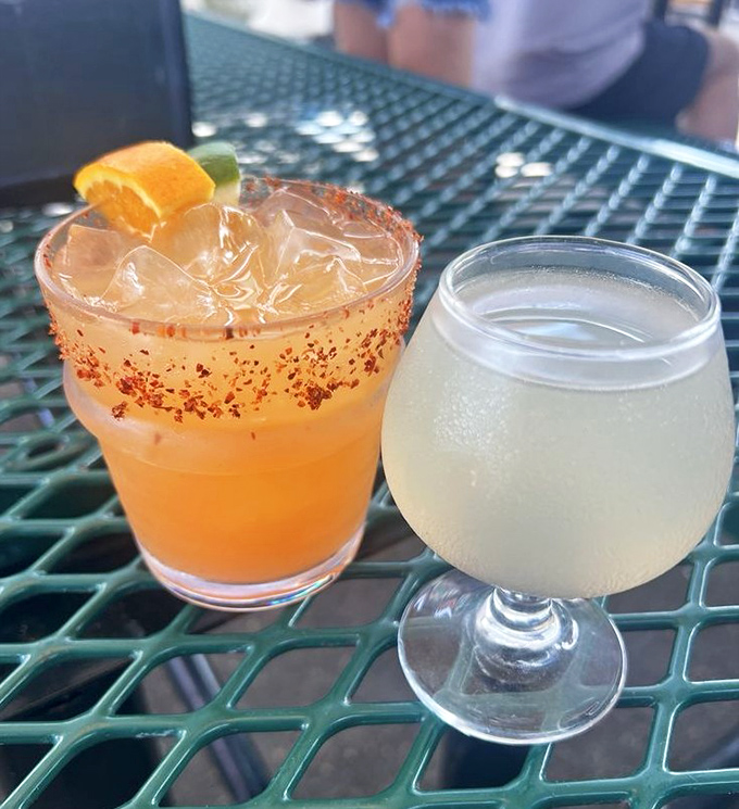 Cocktails that cool the fire but complement the smoke. That spice-rimmed glass isn't just pretty—it's the perfect counterpoint to rich BBQ.