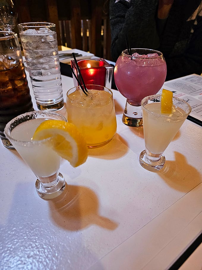 Cocktails that double as conversation pieces. From classic whiskey concoctions to that vibrant pink showstopper, each drink is crafted with Instagram-worthy precision.