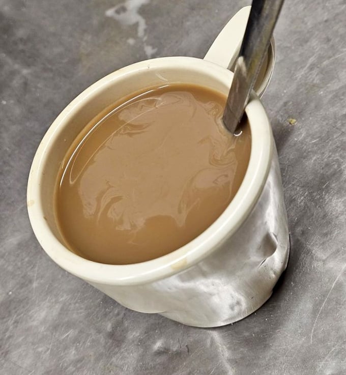 Coffee served in a sturdy mug that's seen more stories than a library. The perfect companion to early mornings or late-night philosophical debates.