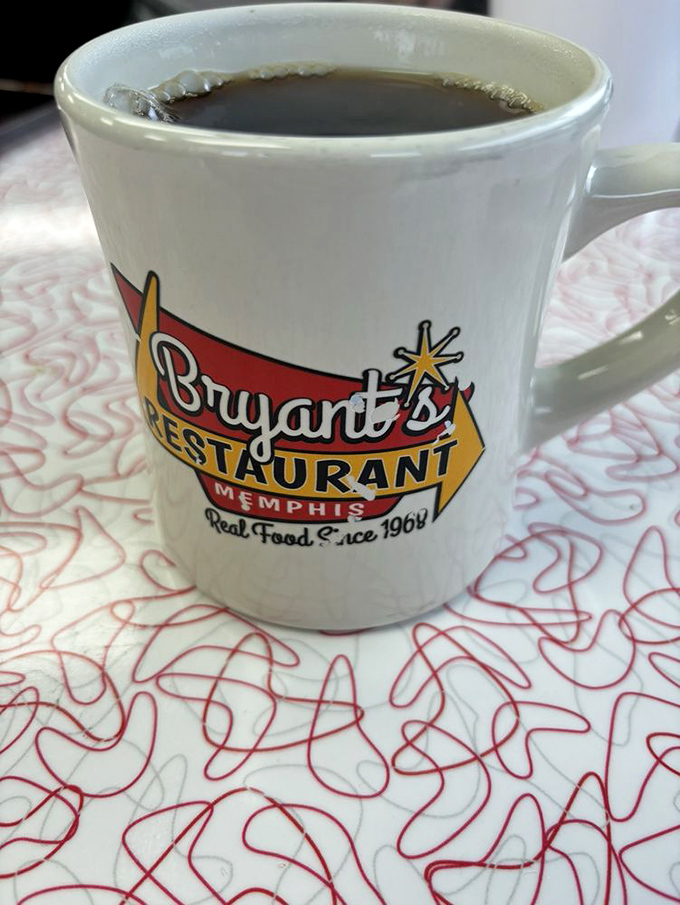 That Bryant's coffee mug isn't just holding caffeine—it's cradling liquid motivation in a vessel that's seen more Memphis mornings than most tour guides.