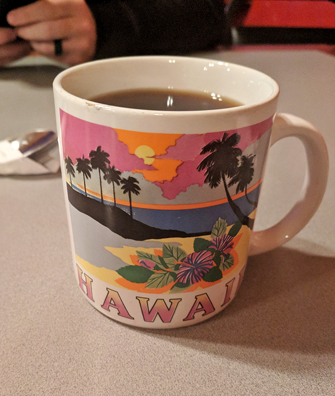 Even the coffee mugs tell stories here&mdash;this Hawaiian souvenir cup holding strong, no-nonsense diner coffee is the perfect metaphor for this delightfully mismatched cafe.