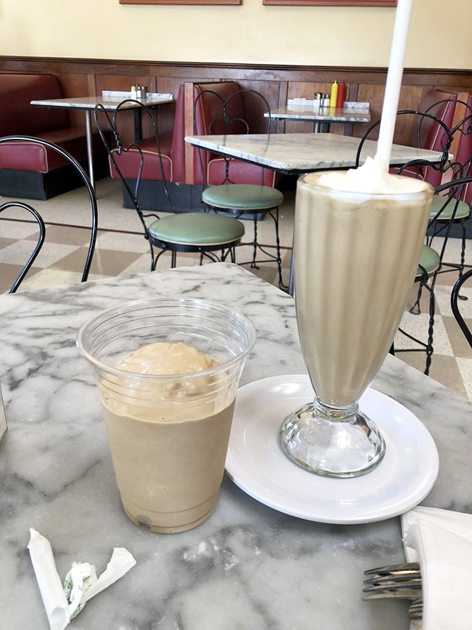 Milkshakes so thick they defy gravity—one for now in the glass, and the bonus round waiting patiently in the metal mixing cup.