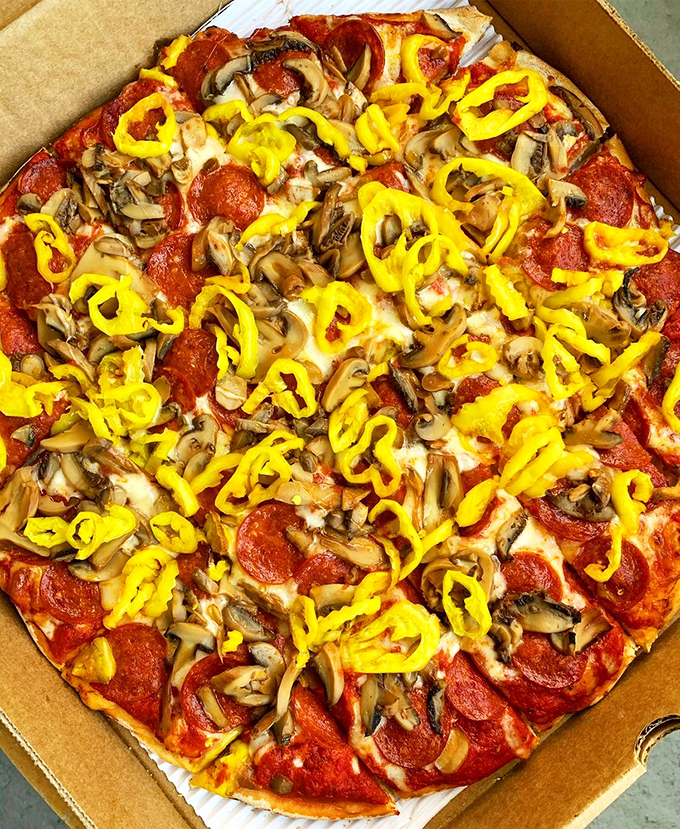 Mushrooms, pepperoni, and banana peppers living harmoniously on one pizza&mdash;a delicious United Nations of toppings that works beautifully.