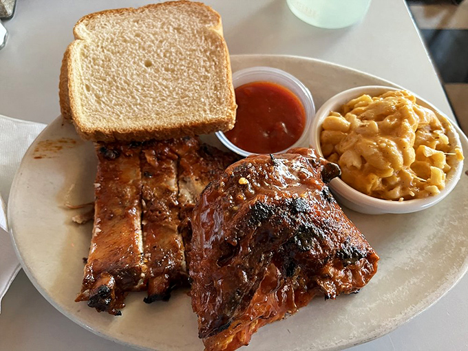 The combo plate that answers life's toughest question: "Why choose between ribs and chicken when you can have both?"