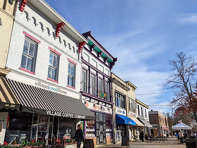 Village Coffee Company anchors this stretch of Broadway, where colorful Victorian details pop against the clear Ohio sky.