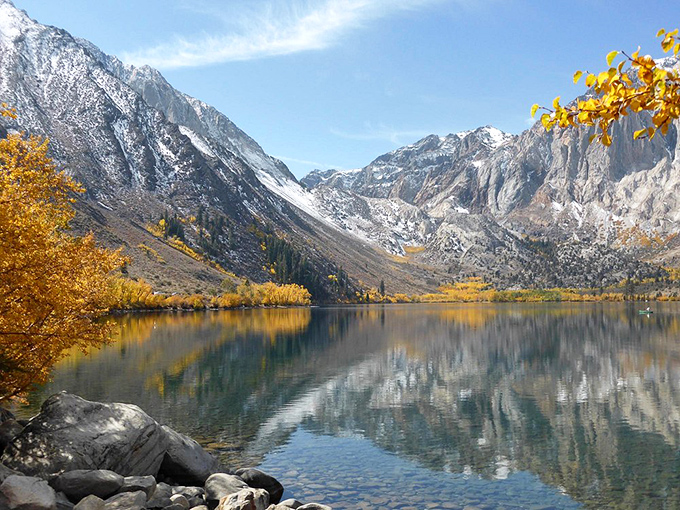 Autumn gold at Convict Lake: The aspen trees put on their seasonal show while mountains reflect in waters so clear you can count the pebbles below.
