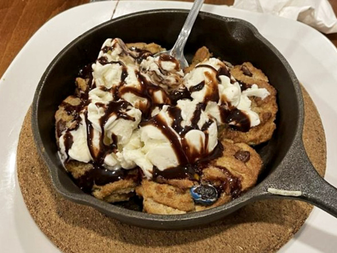 Dessert that speaks to your inner child&mdash;a warm cookie skillet topped with ice cream and chocolate drizzle. Resistance is futile, diet starts tomorrow.