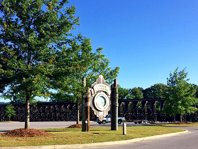 This wooden sign welcomes visitors to Coosa Landing, where outdoor adventures begin and end with the same satisfied smile.