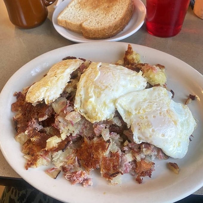 Breakfast of champions, or at least people who plan to be horizontal afterward. Corned beef hash topped with eggs that mean business.