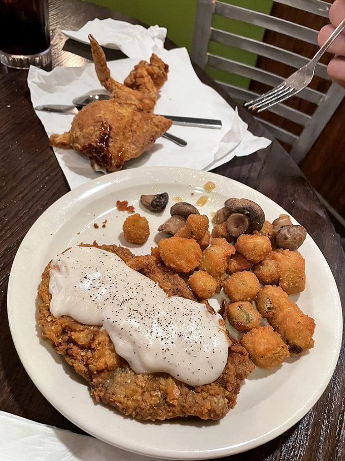 Country fried steak smothered in gravy with a supporting cast of fried delights. Your cardiologist just felt a disturbance in the force.