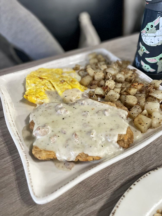 Country fried steak swimming in creamy gravy alongside golden potatoes and fluffy eggs&mdash;the breakfast equivalent of a warm hug from your favorite aunt.