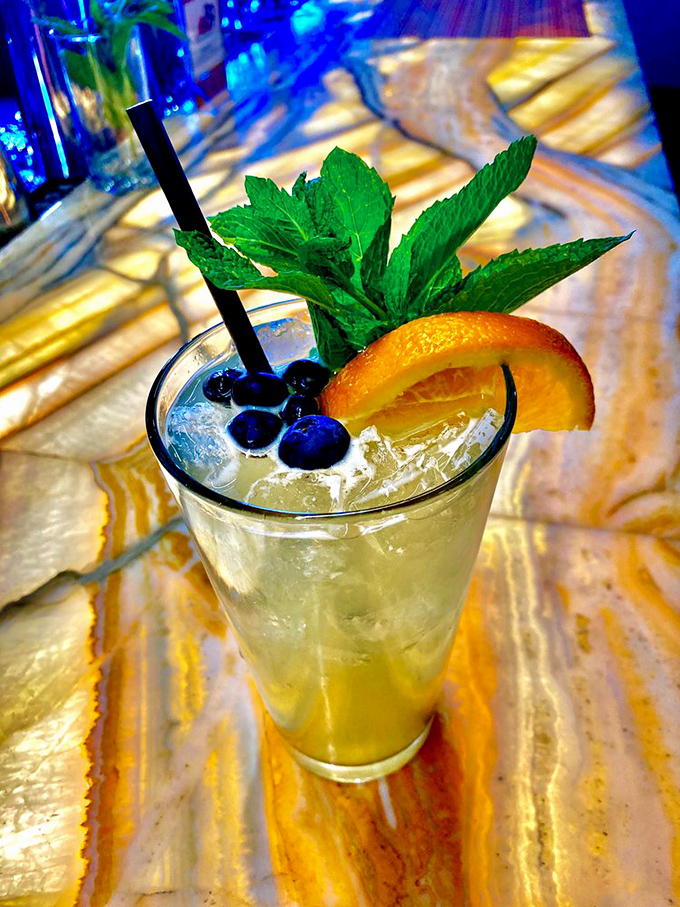 That refreshing cocktail garnished with fresh mint looks like summer vacation decided to visit your glass.