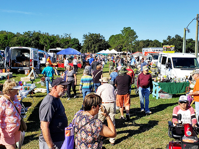 The universal flea market shuffle—part leisurely stroll, part strategic mission, all performed under the Florida sun.