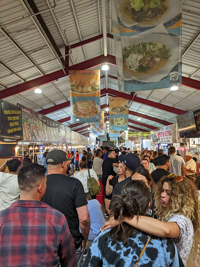 Weekend crowds navigate the culinary labyrinth. The universal language of "that looks good" transcends all cultural barriers here.