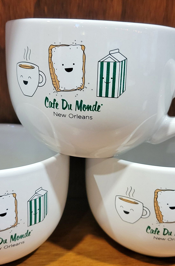 Whimsical mugs featuring cartoon beignets with faces&mdash;because your pastry should smile back at you before you devour it without remorse.
