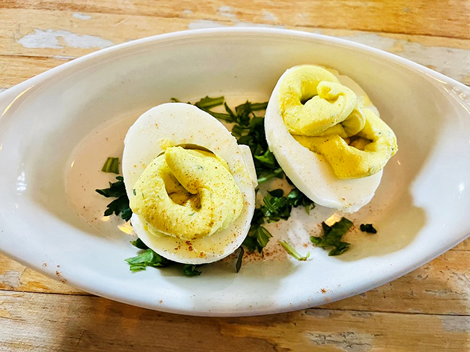 These aren't your standard picnic deviled eggs&mdash;they're a study in simplicity and perfection, dusted with paprika and fresh herbs.