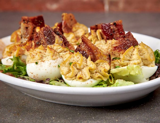 Deviled eggs gone rogue with smoked pork and bacon. These aren't your grandmother's picnic eggs&mdash;unless your grandmother was secretly a culinary genius.