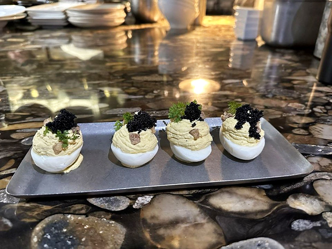 Deviled eggs wearing their Sunday best, topped with caviar. These aren't your grandmother's potluck contribution&mdash;unless Grandma was secretly a culinary rebel.
