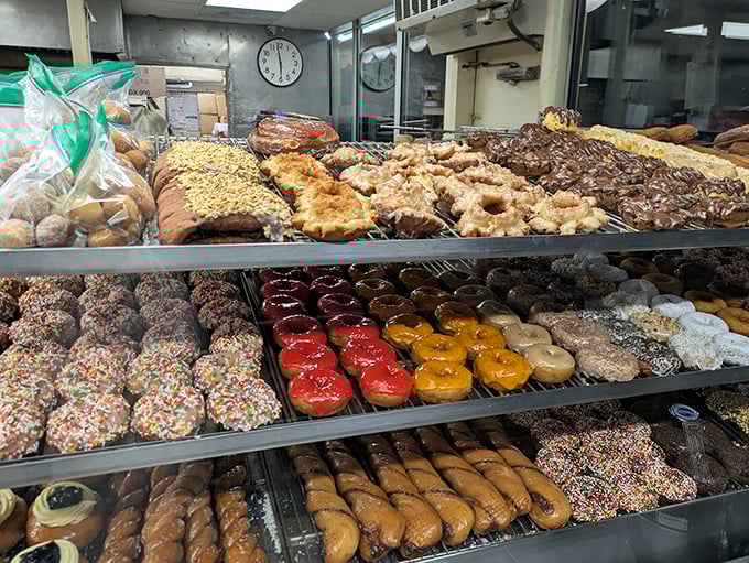 The display case: where donut dreams come true and diet resolutions go to die, gloriously and without regret.