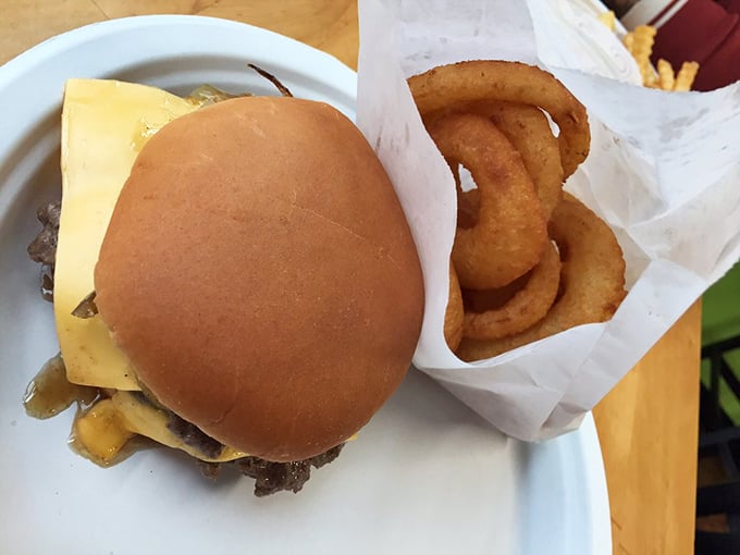 The perfect Wisconsin lunch trifecta: a juicy burger, crispy onion rings, and the knowledge that dinner is still hours away.