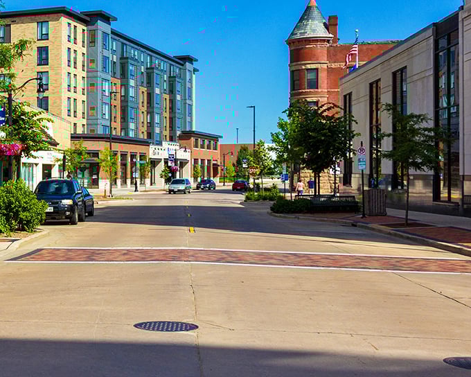 Downtown Eau Claire's blend of architectural styles creates a visual rhythm that feels both planned and organic. The turret adds a fairy-tale touch to this real-world setting.