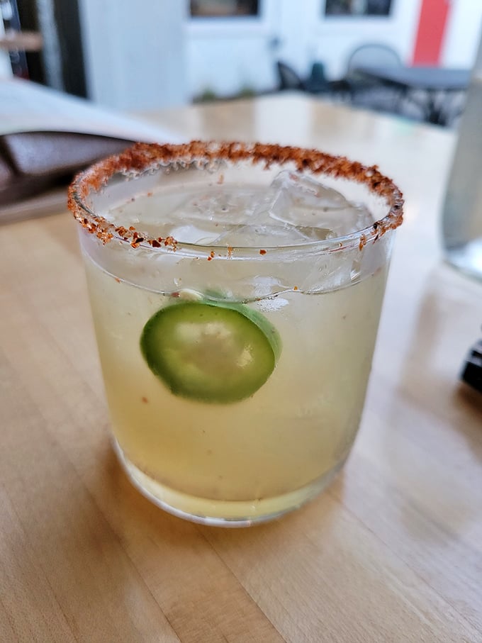 This isn't just a margarita; it's summer in a glass with that spicy rim standing guard like a delicious bouncer for your taste buds.