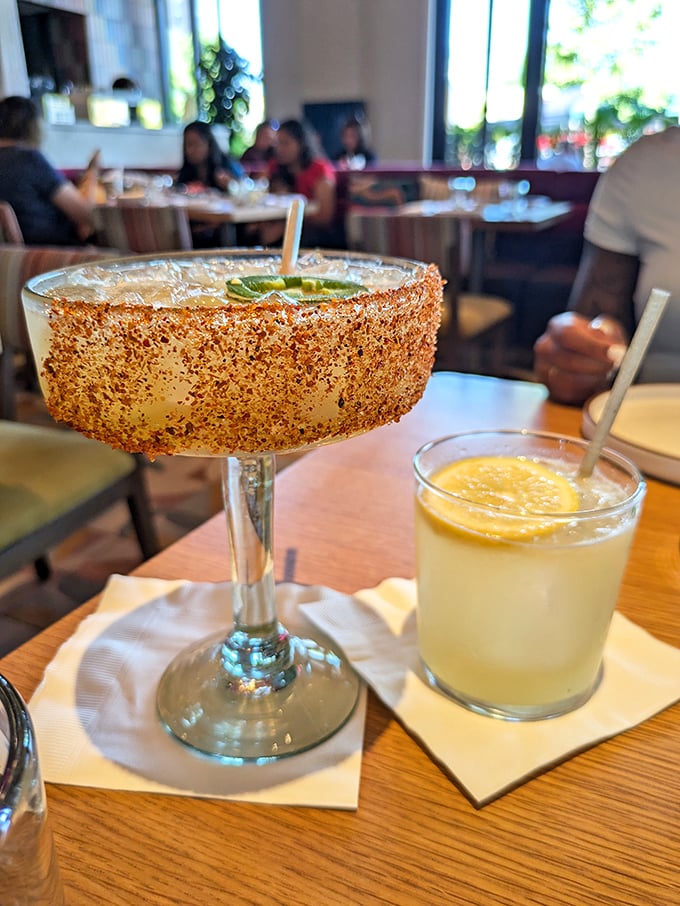 A margarita rimmed with tajin sits beside what appears to be a paloma. Name a more perfect pairing than tequila and lime&mdash;I'll wait.