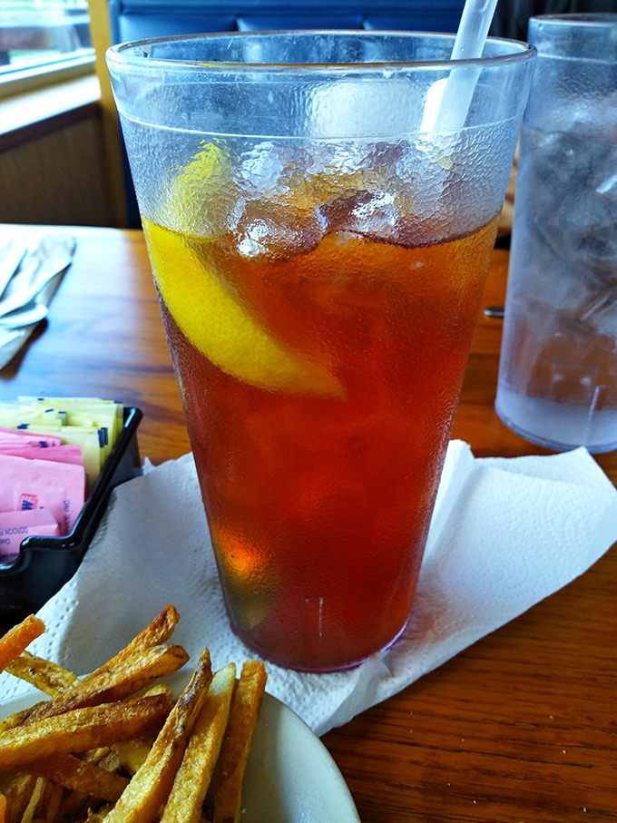 Sweet tea so perfectly amber it looks like liquid sunshine, served in glasses big enough to quench a serious BBQ thirst.